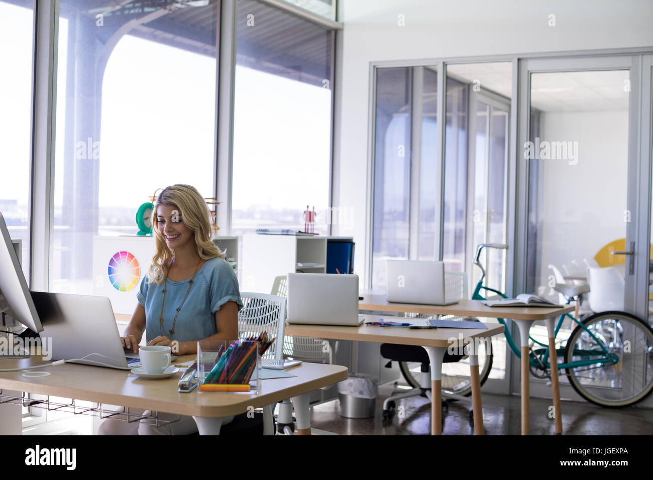 Female executive working at her desk in office Stock Photo - Alamy