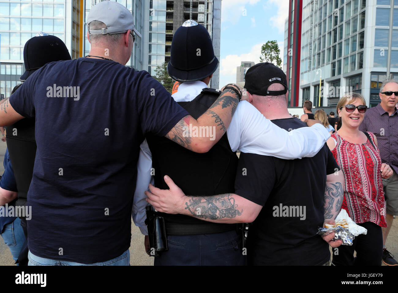 Guns N' Roses 2017 fans hug policeman at entrance to Queen Elizabeth ...