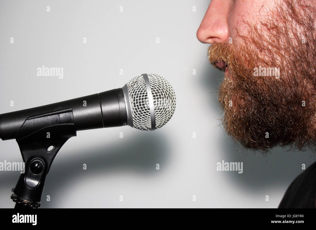 Microphone on stand white background with copy space man beard stock ...
