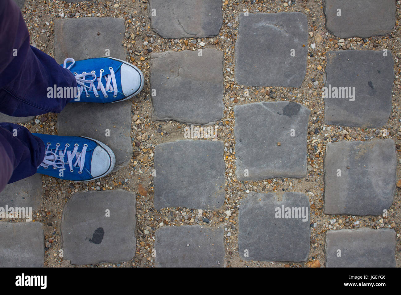 Walking on paving street Stock Photo - Alamy