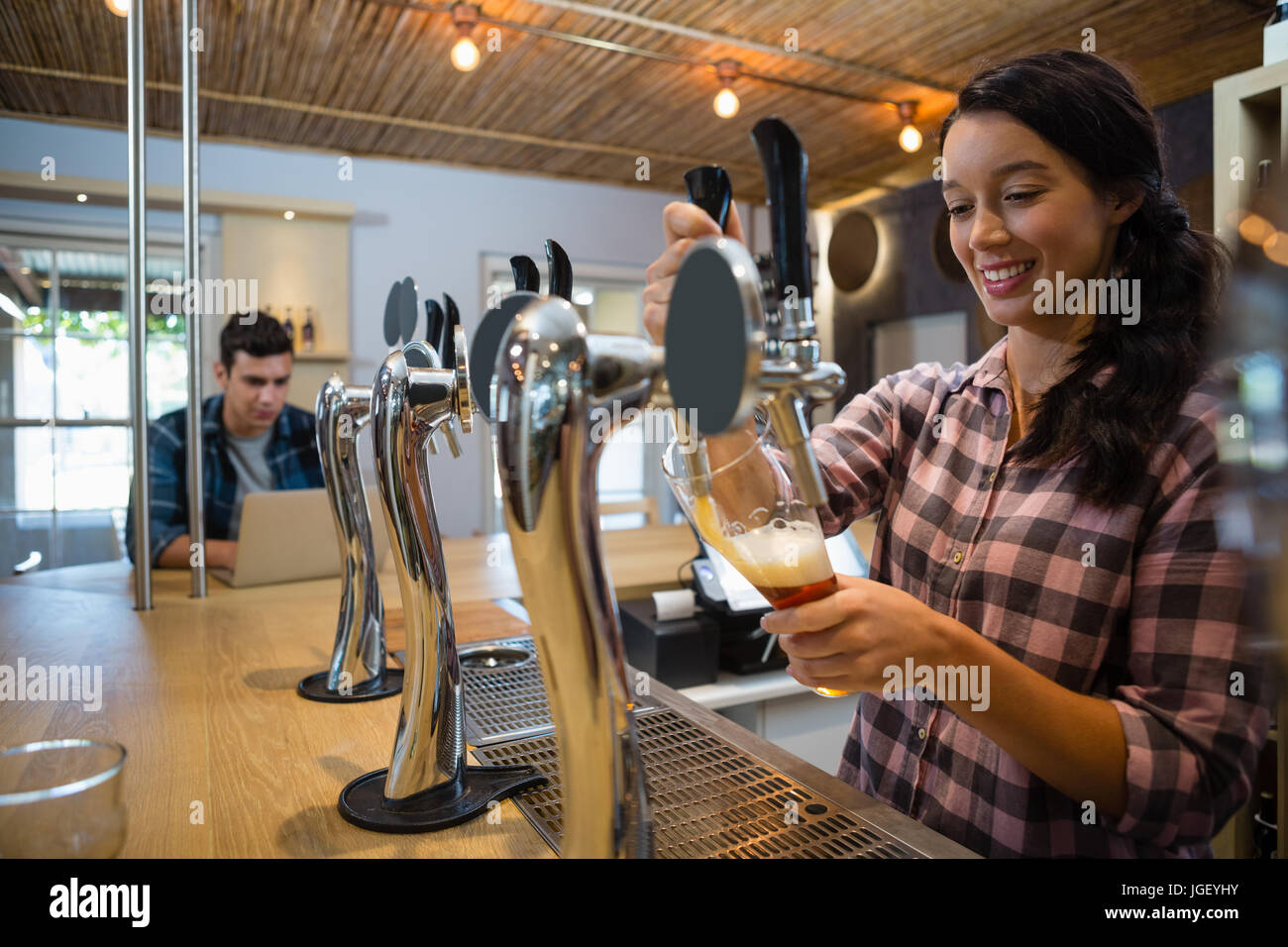 Beautiful barmaid pouring beer in hi-res stock photography and images ...