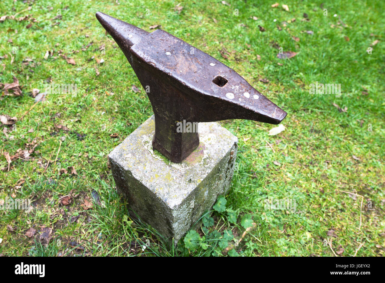 Original old anvil over concrete block Stock Photo - Alamy
