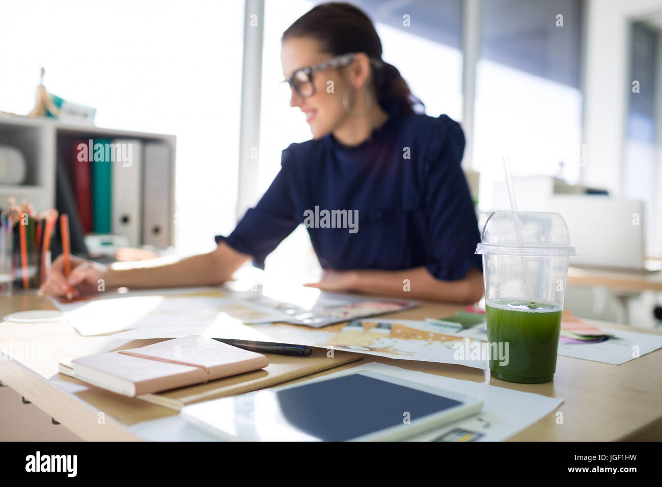 Female executive working at her desk in office Stock Photo - Alamy