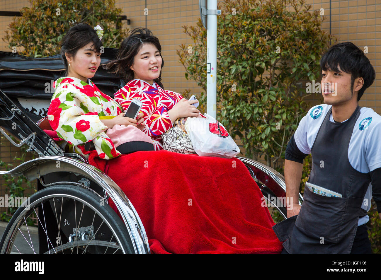 Girls in traditional dress in a rickshaw in Asakusa, Tokyo, Japan Stock ...