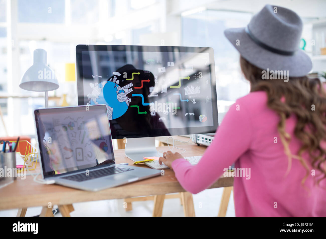 Female executive working on computer at desk in the office Stock Photo ...
