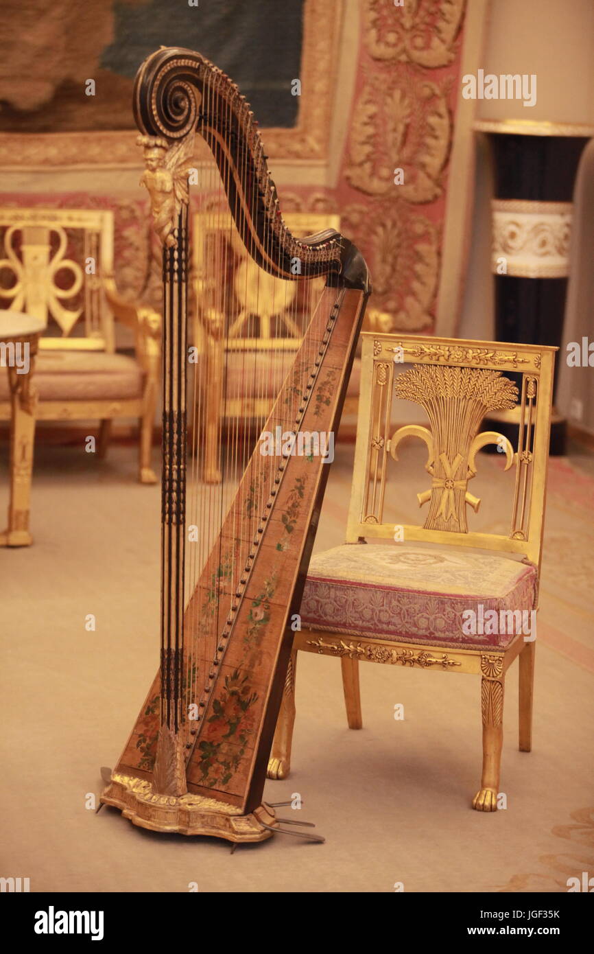 Golden Harp music in luxury interior Stock Photo - Alamy