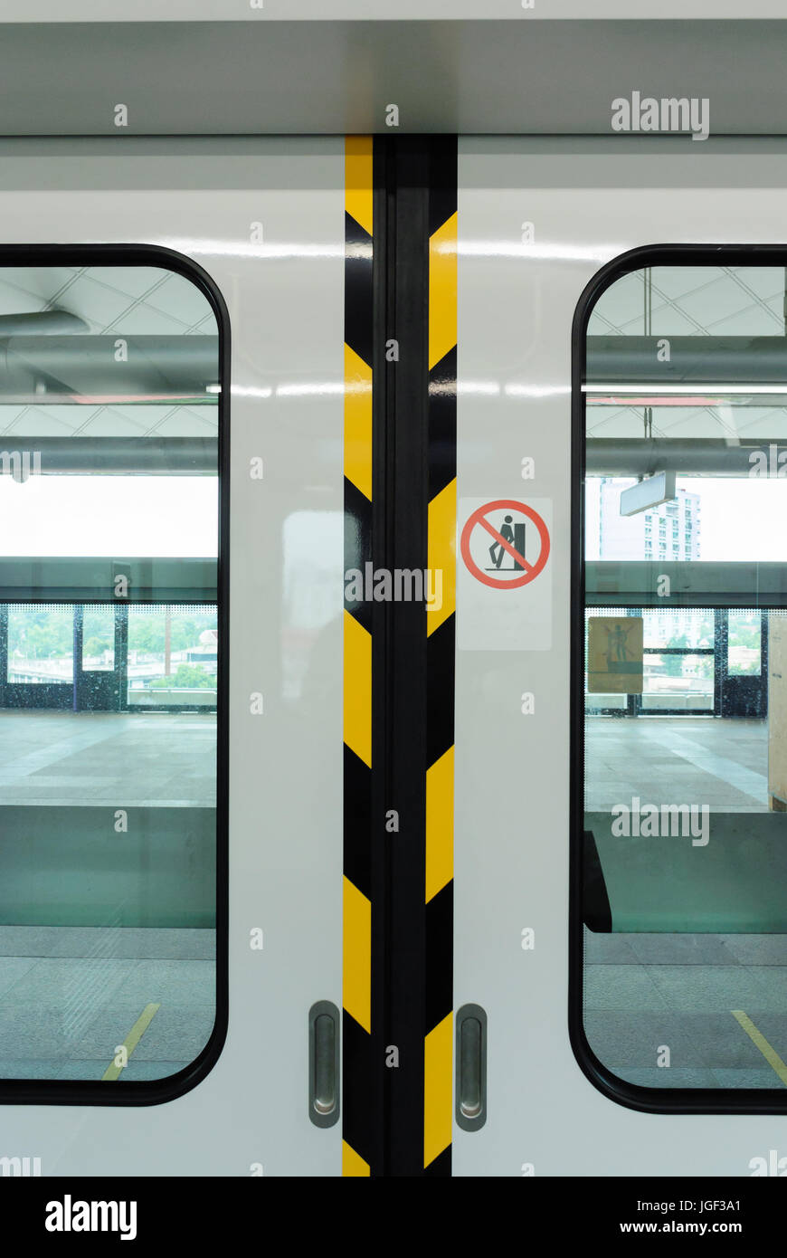 The image shows the door in Metro. Metro doors closed Stock Photo - Alamy