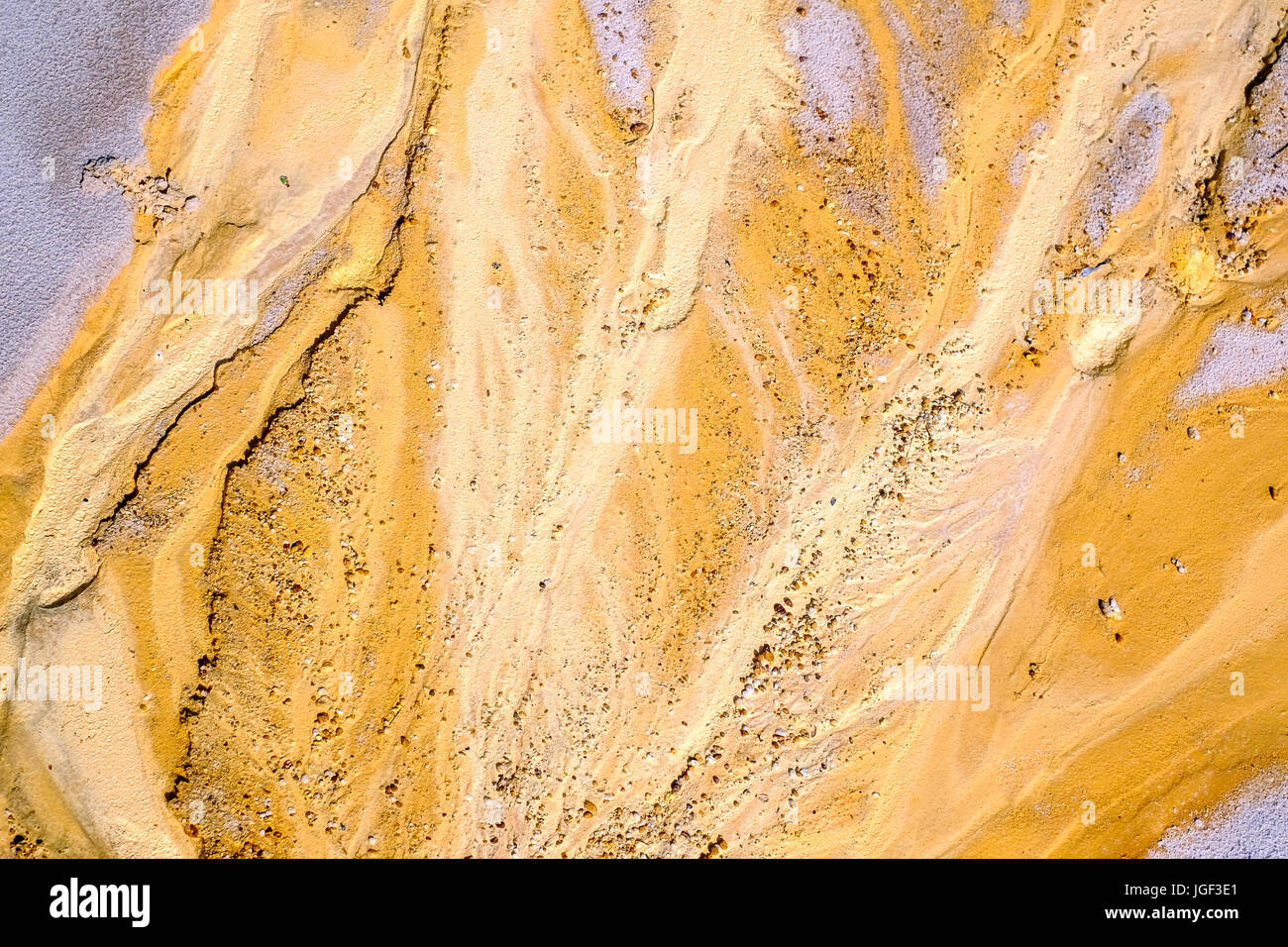 Water streak on golden sand on the beach Stock Photo - Alamy