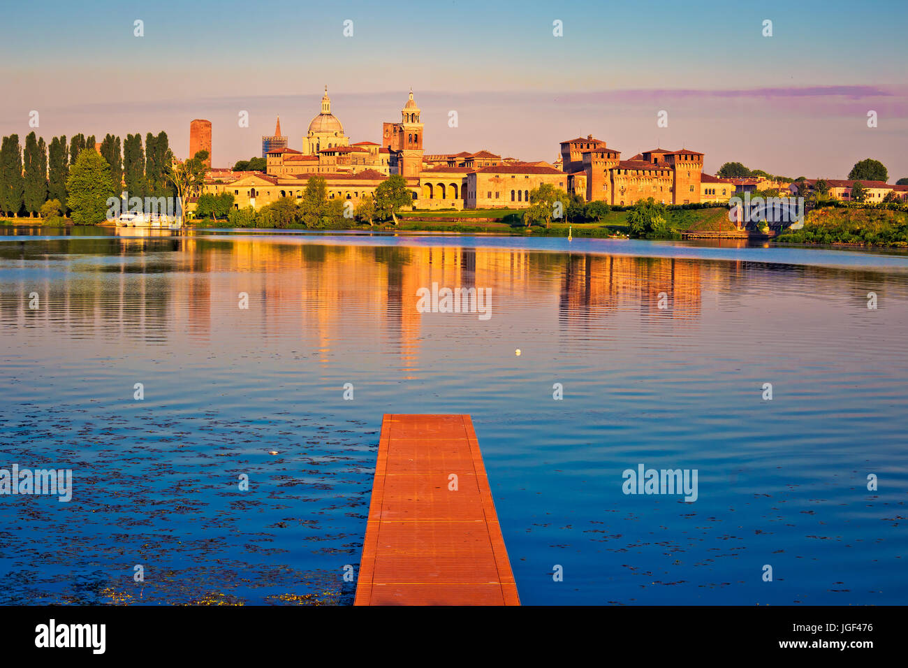 City of Mantova skyline early morning view from lago Inferiore ...