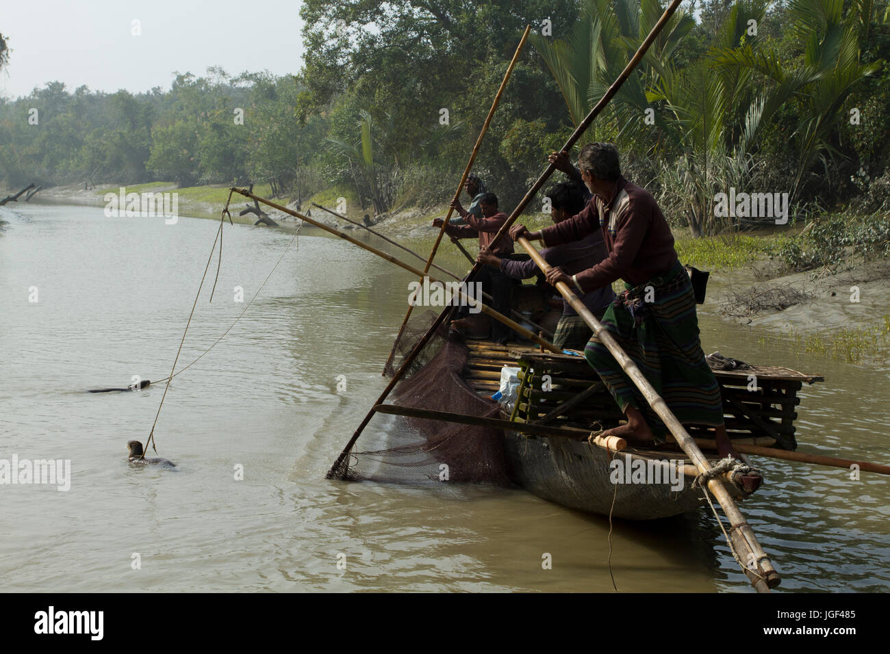 Fishermen fishing with otters in the Sundarbans, a UNESCO World ...