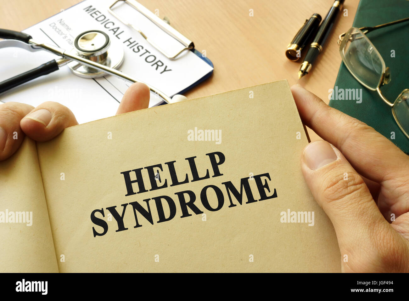 Book with title Hellp Syndrome on a table Stock Photo - Alamy