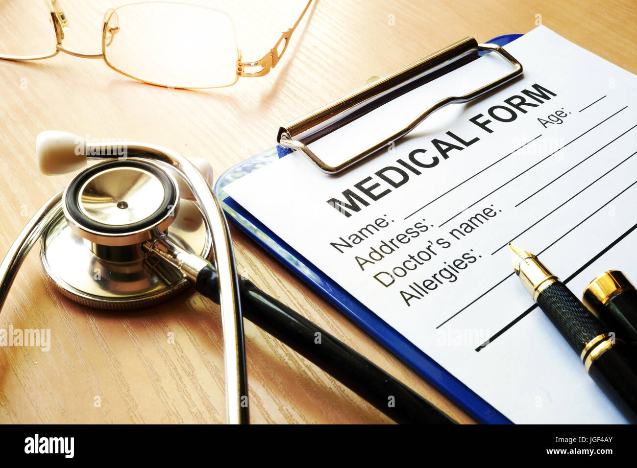 Stethoscope and medical form on a worktable Stock Photo - Alamy