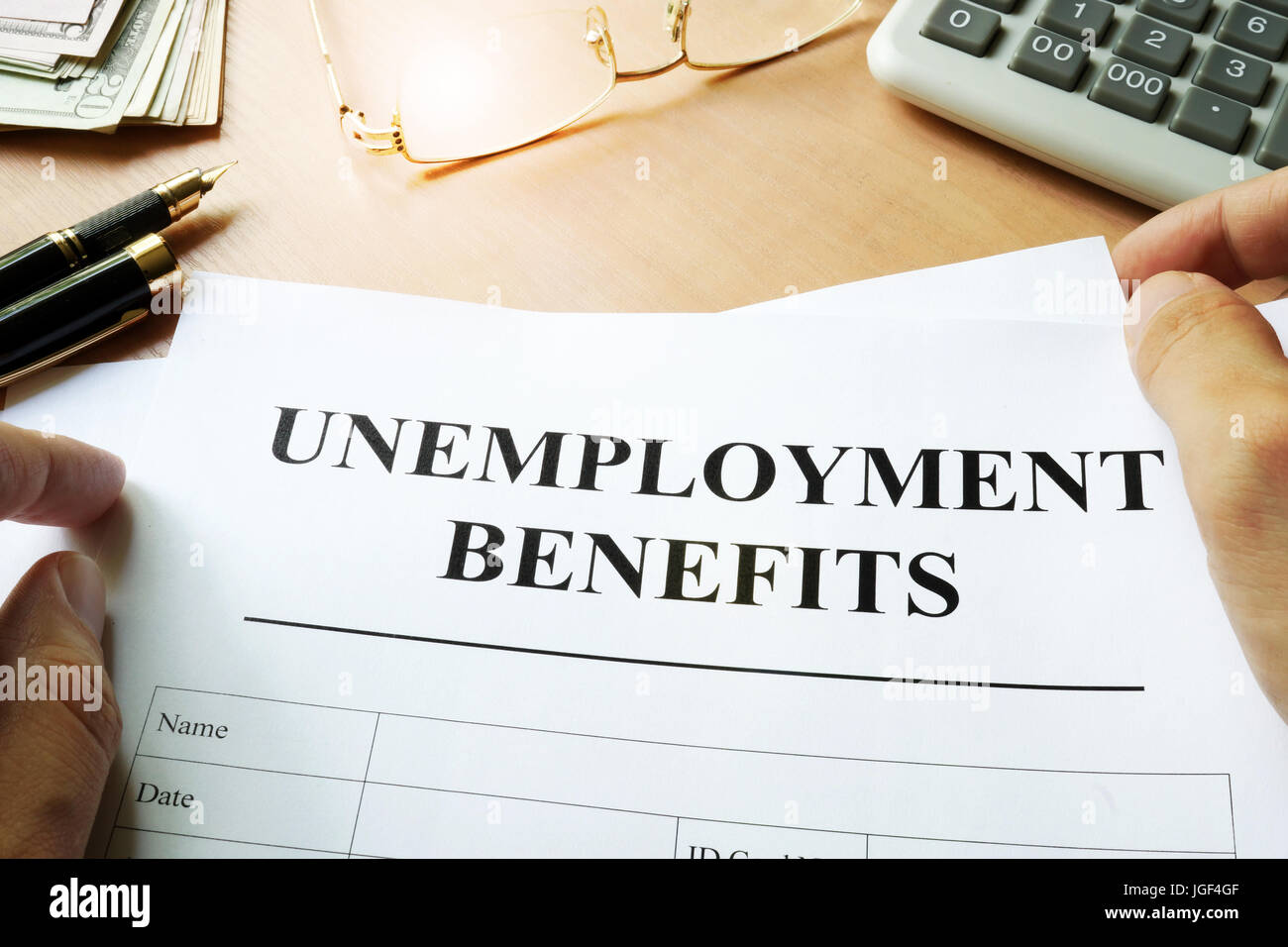 Unemployment benefits form on a table Stock Photo - Alamy