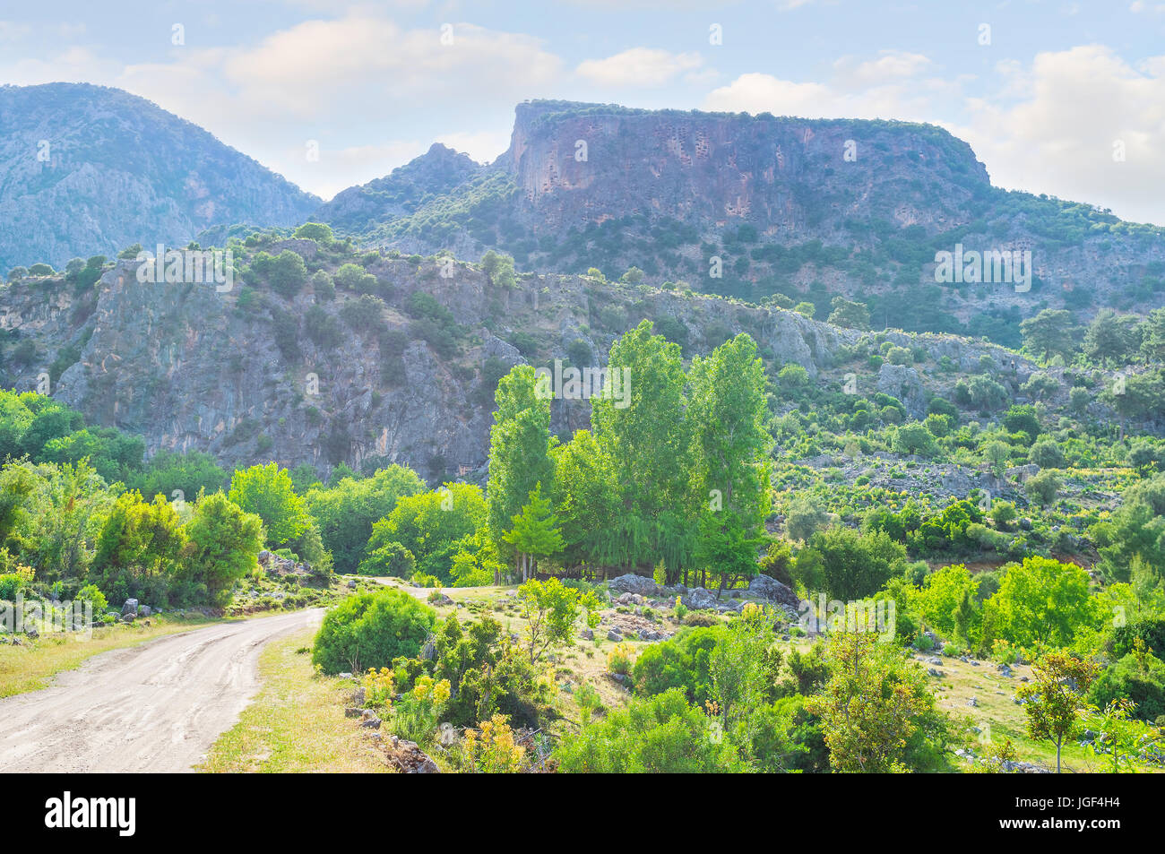 Ancient city Pinara located on the rock with rock-cut tombs on the ...