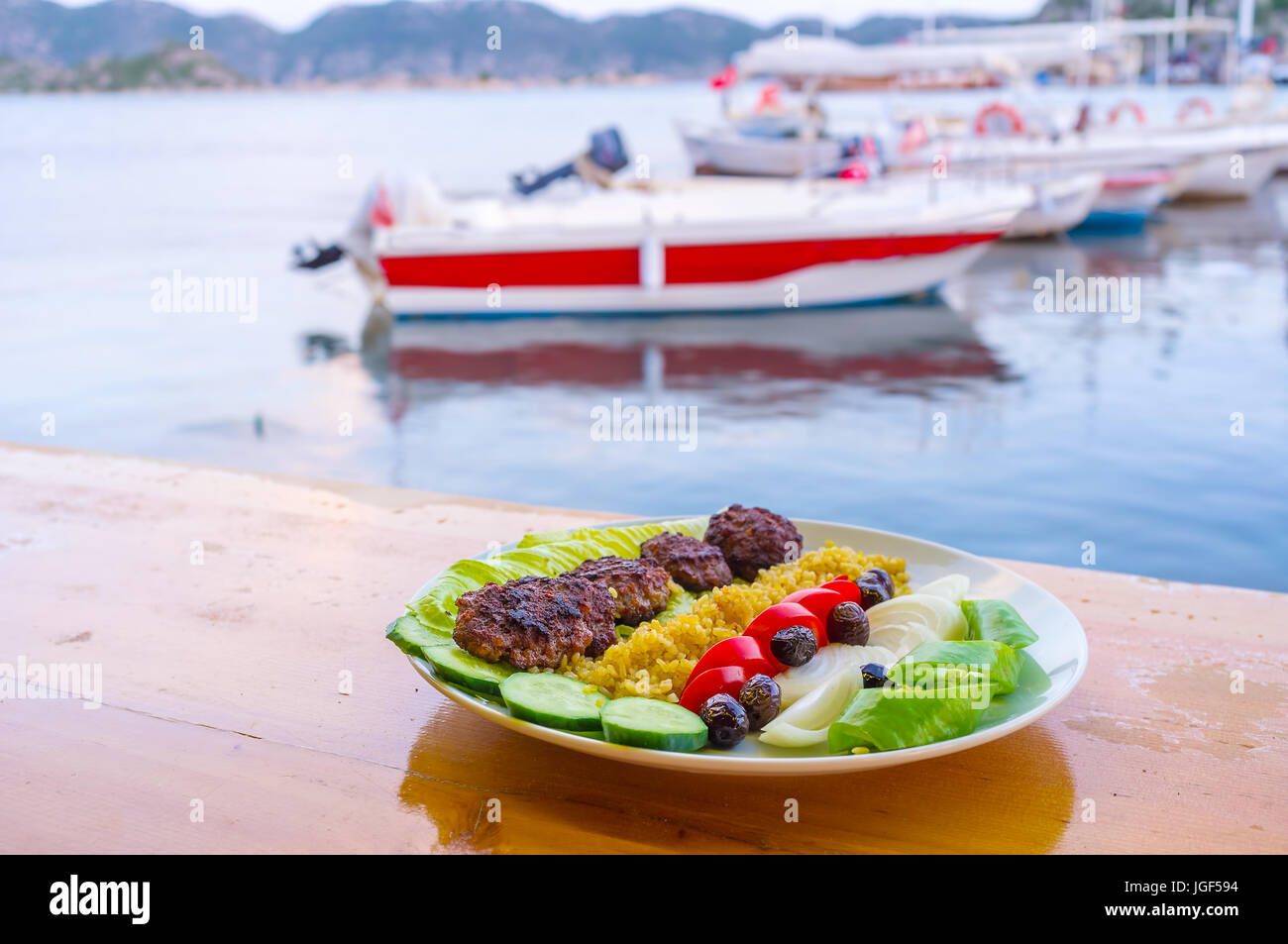 Kofta is a traditional turkish dish, contains fried meatballs, rice and ...