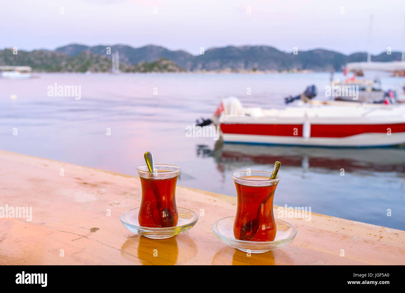 Invigorating strong turkish tea always served in traditional glasses ...