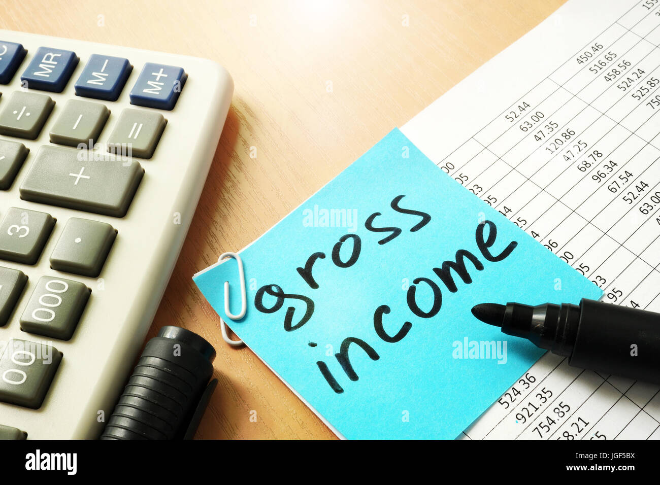 Gross income written on a memo stick Stock Photo - Alamy
