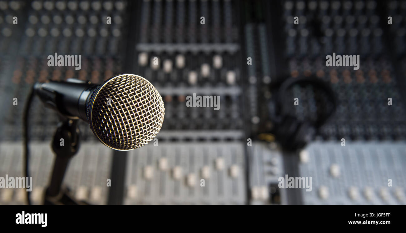 Microphone and Headphones on dirty sound mixer panel, France Stock ...