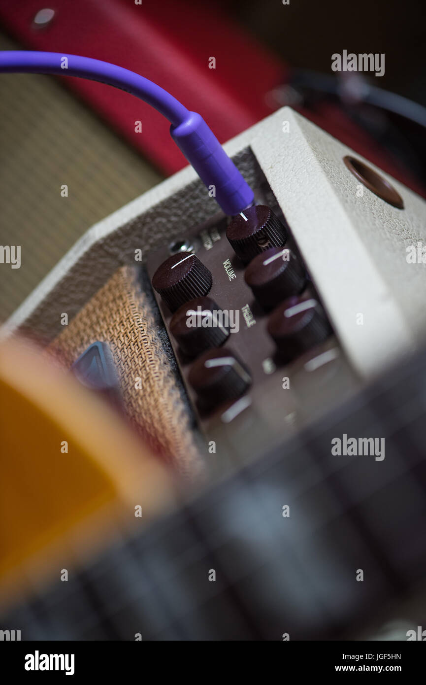 Guitar amplifier with jack cable, Music Shop, France Stock Photo - Alamy