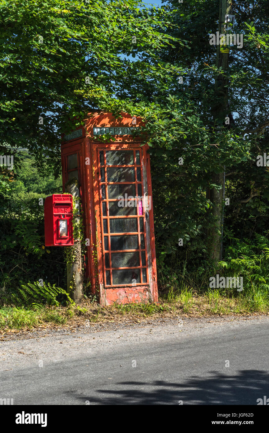 Old red telephone box& red letter posting box on country / rural road ...