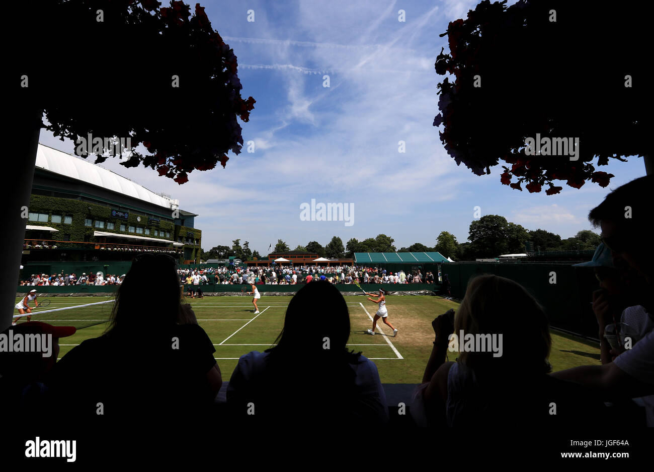 Spectators watch Doubles action on court four on day four of the ...
