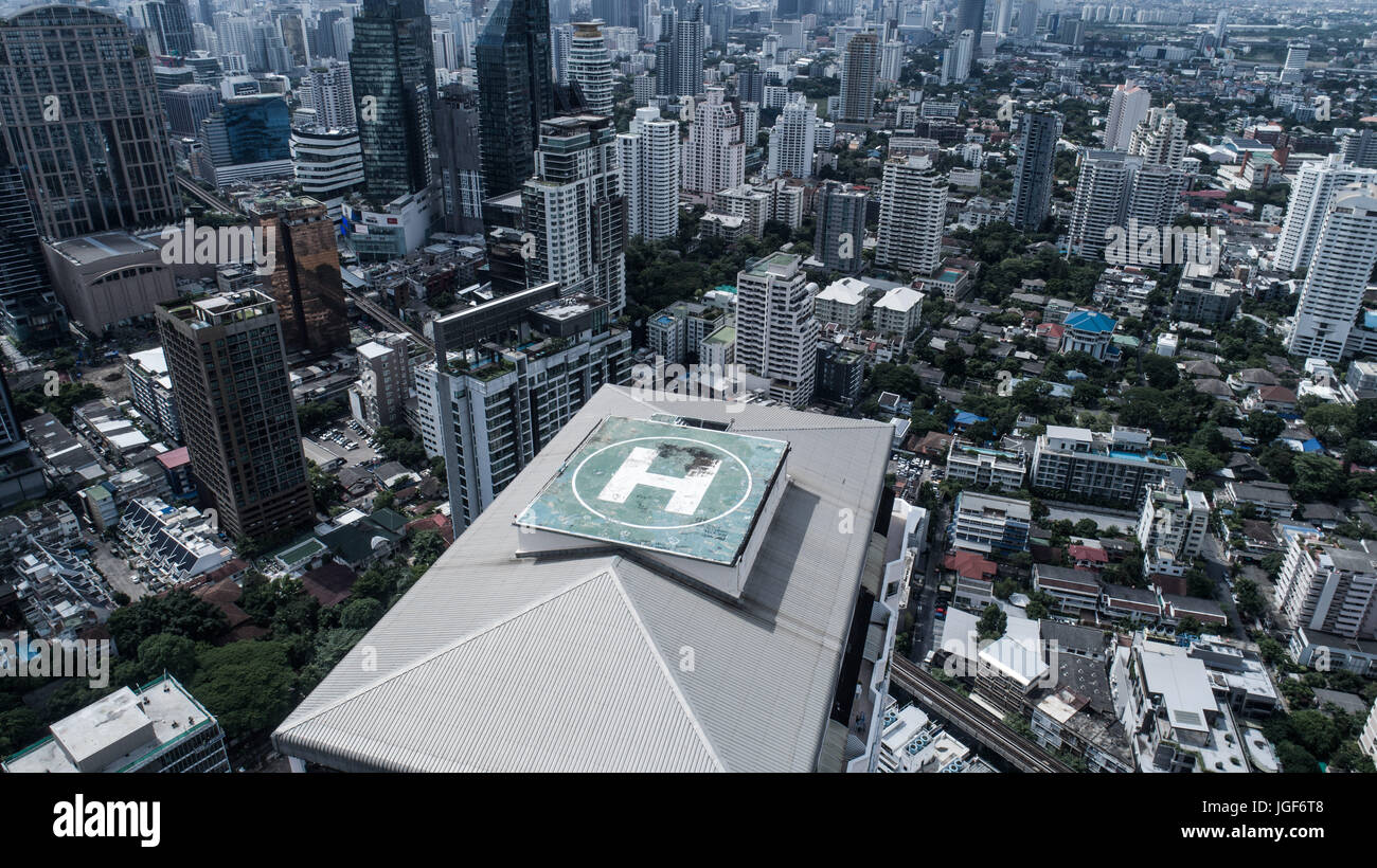 Aerial drone view of helipad isolated on top of the skycraper in ...