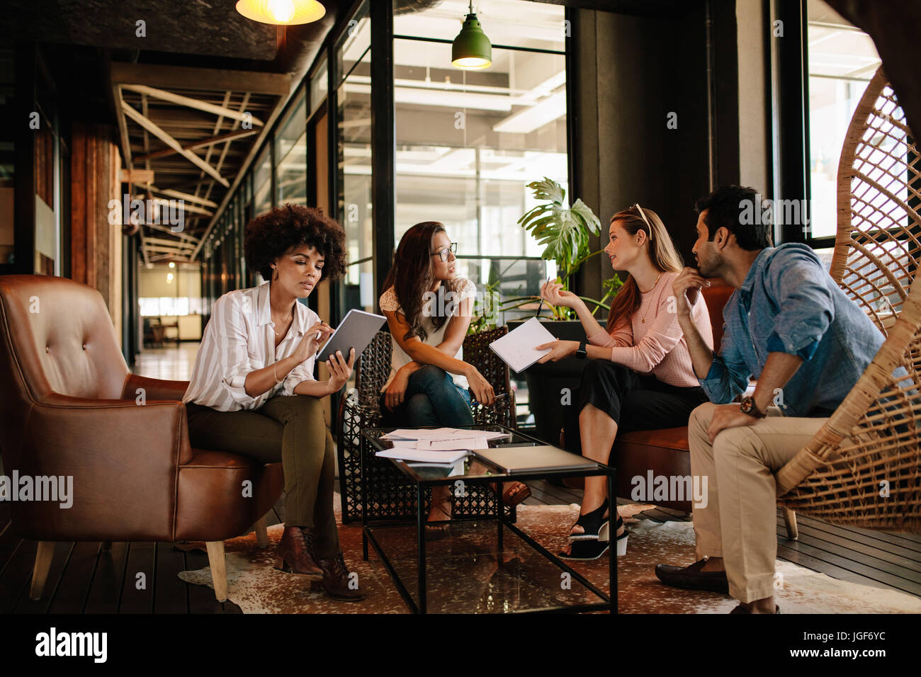 Team young professionals having discussion in office. Executives ...