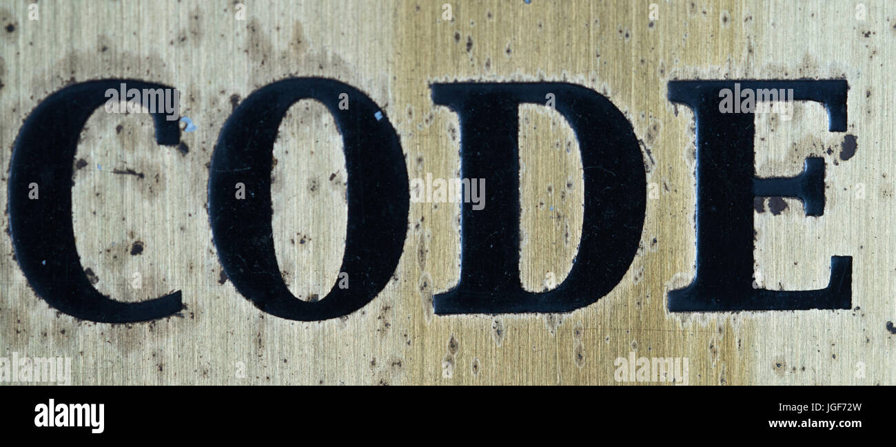 Word "code" in black letters isolated on rusty metal background Stock ...