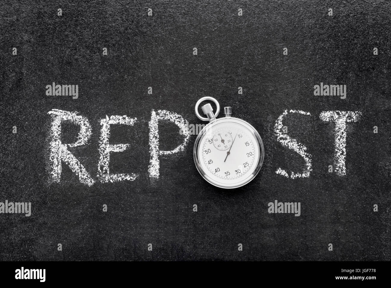 repost word handwritten on chalkboard with vintage precise stopwatch ...