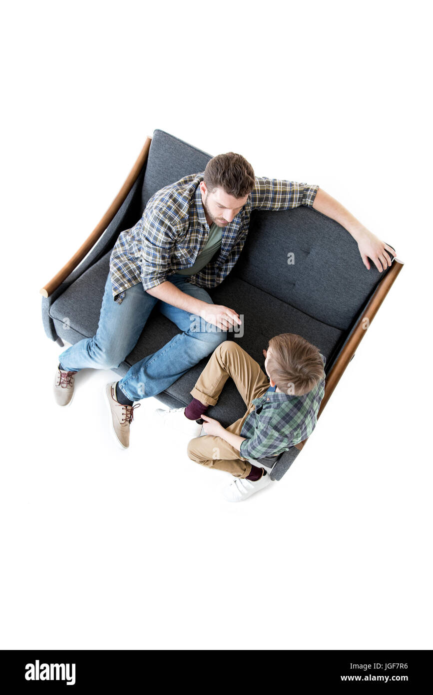 High angle view of father and son quarreling, family problems concept ...