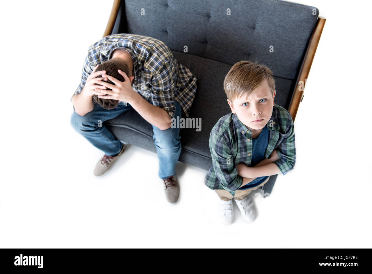 High angle view of father and son quarreling, family problems concept ...