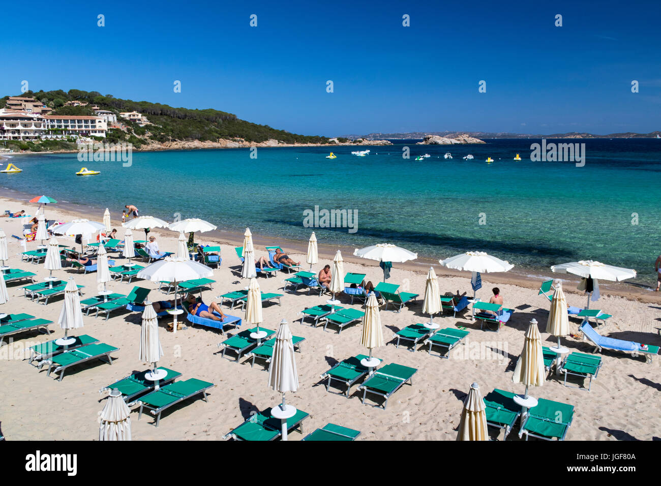 Blue Sky, Parasols and Sunbeds - View looking at Cala Batistoni Beach ...