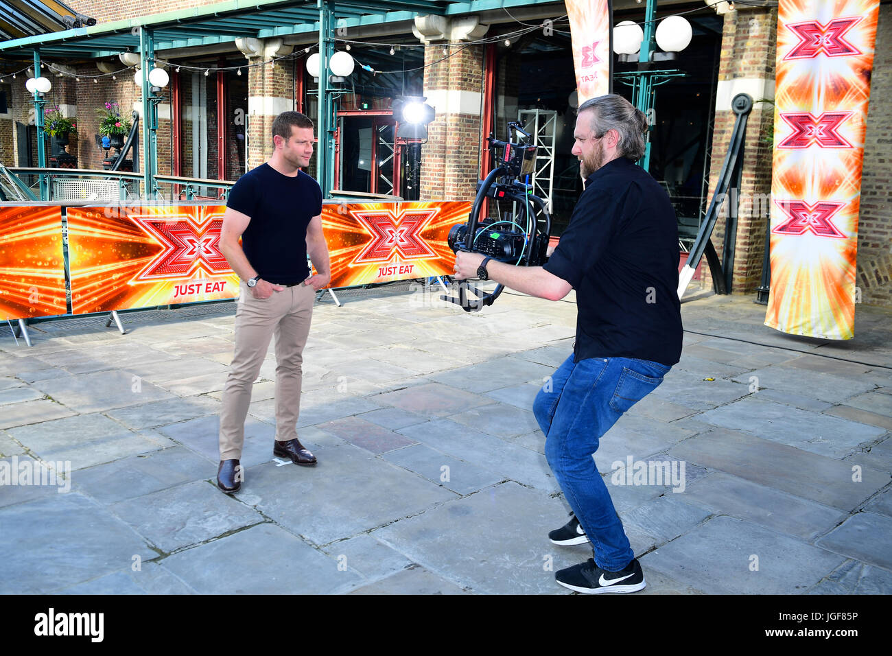 Dermot oleary attending x factor filming tobacco dock hi-res stock ...