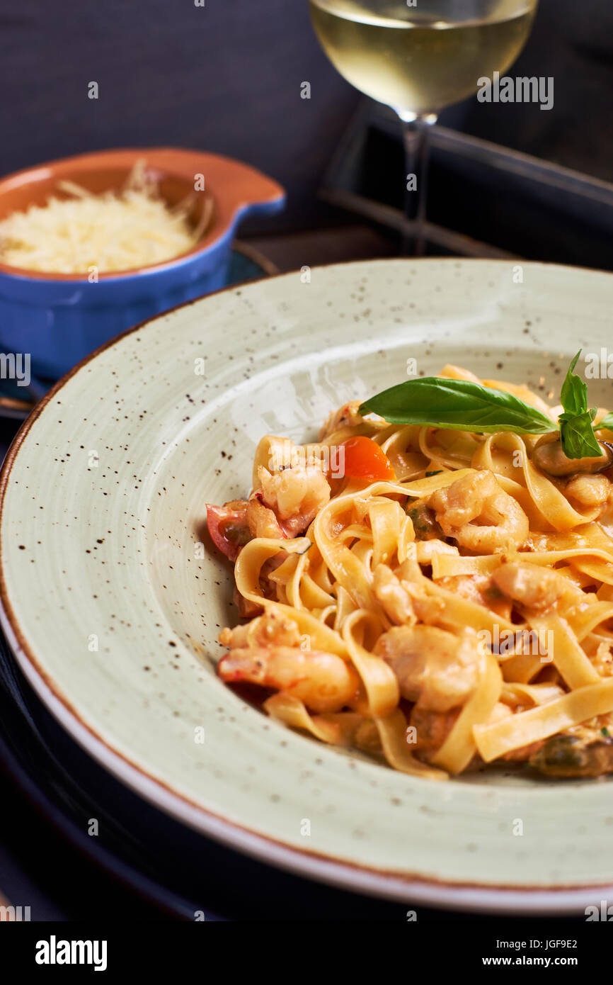 Tagliatelle with prawns and spices Stock Photo - Alamy