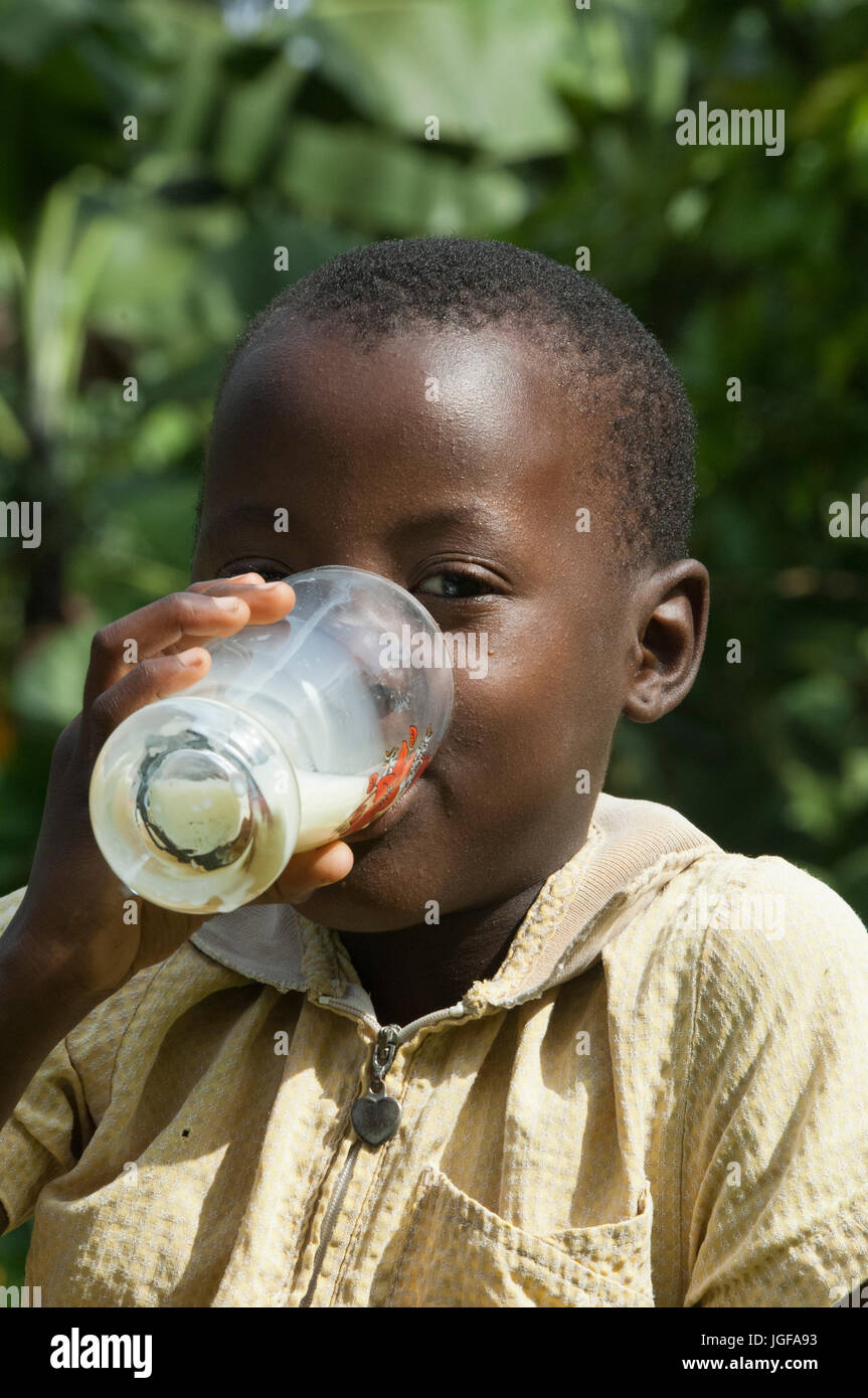 Happy child drinking a glass of milk, Rwanda Stock Photo - Alamy
