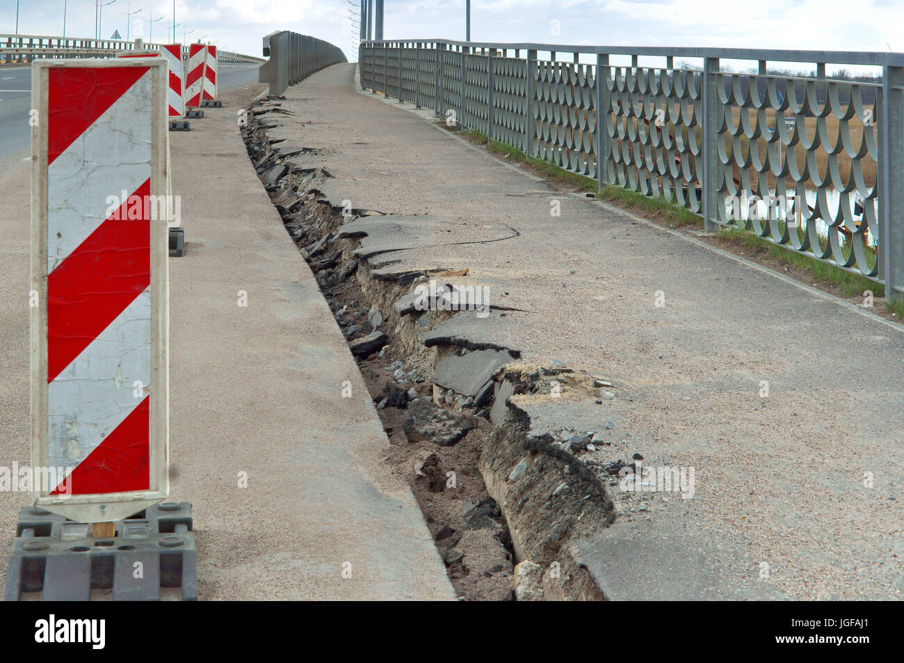 repair broken sidewalk pavement cracks Stock Photo - Alamy