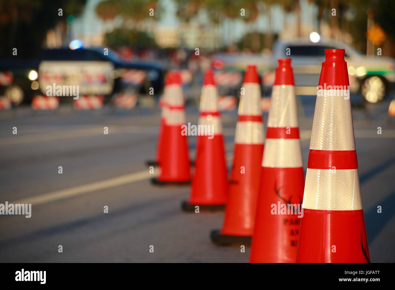 Orange and White Caution Cones Lined Up in Front of Police Cars with ...