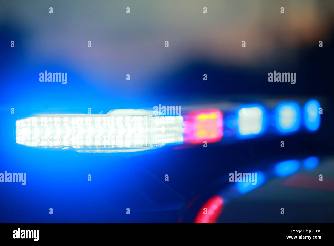 Red and Blue Lights on Top of Police Car During Flashing After Dusk in ...