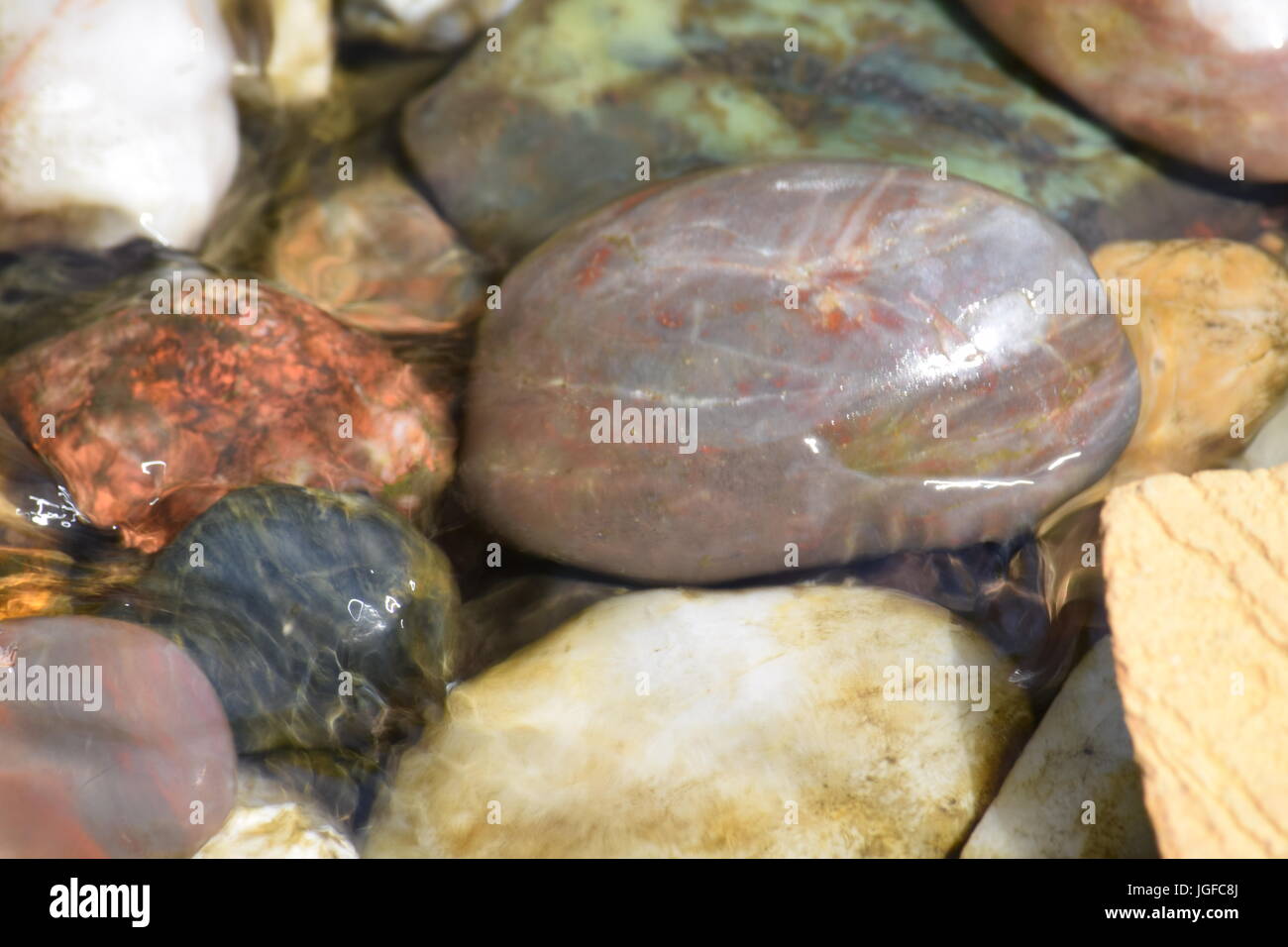 Wet pebble colours hi-res stock photography and images - Alamy