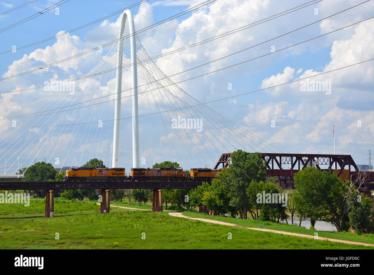 A Union Pacific freight train leaving downtown Dallas, passing over the ...