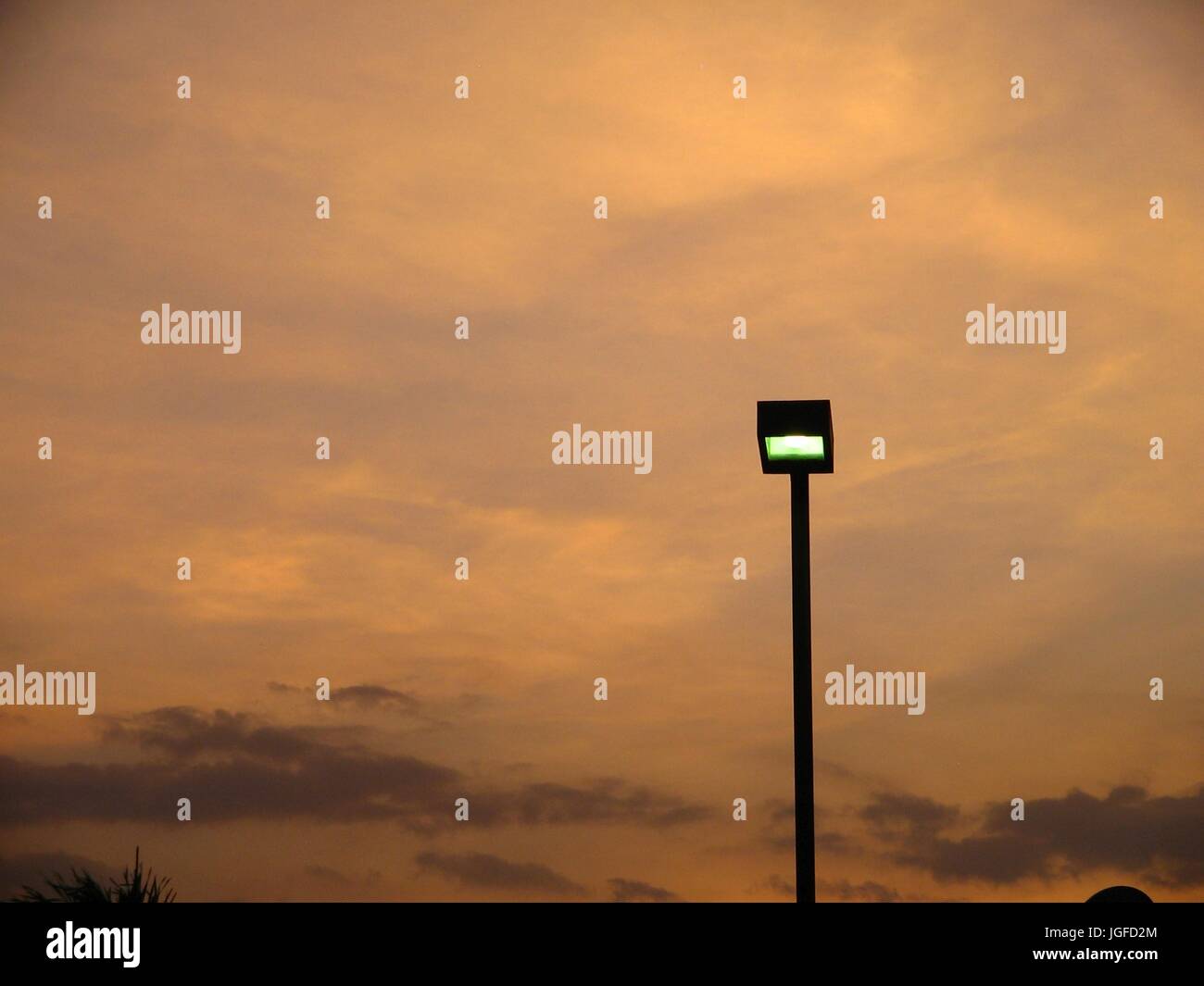 Public street lighting pole, sunset on background Stock Photo - Alamy
