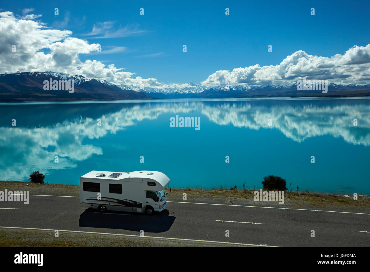 Campervan on State Highway 8, and Aoraki / Mount Cook reflected in Lake ...