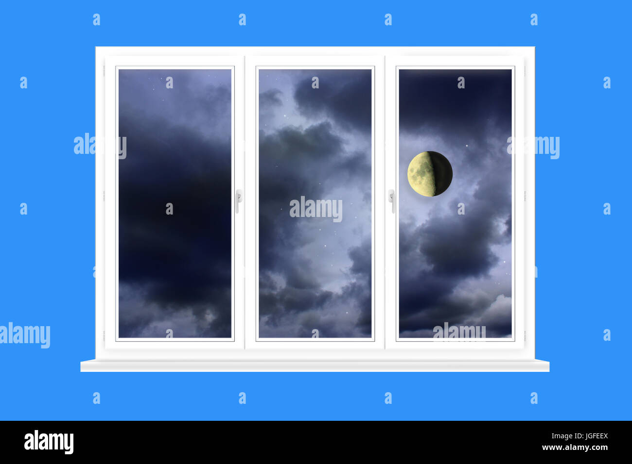 window with view to Moon on the dark cloudy evening sky Stock Photo - Alamy