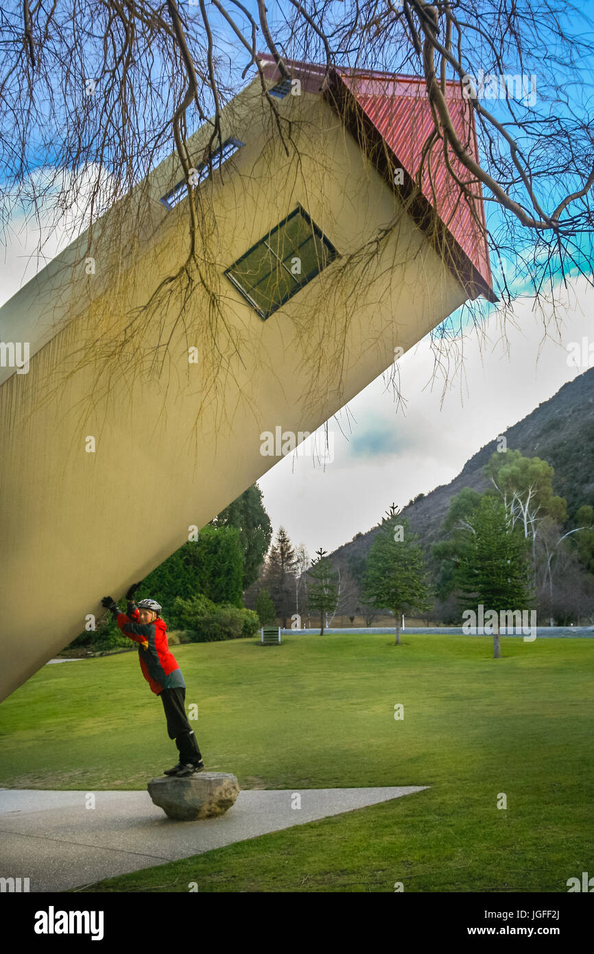 Girl catching falling building in a theme park in New Zealand Stock ...