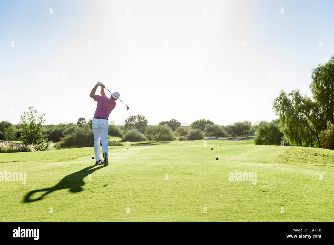 Rear view teeing off golf hi-res stock photography and images - Alamy