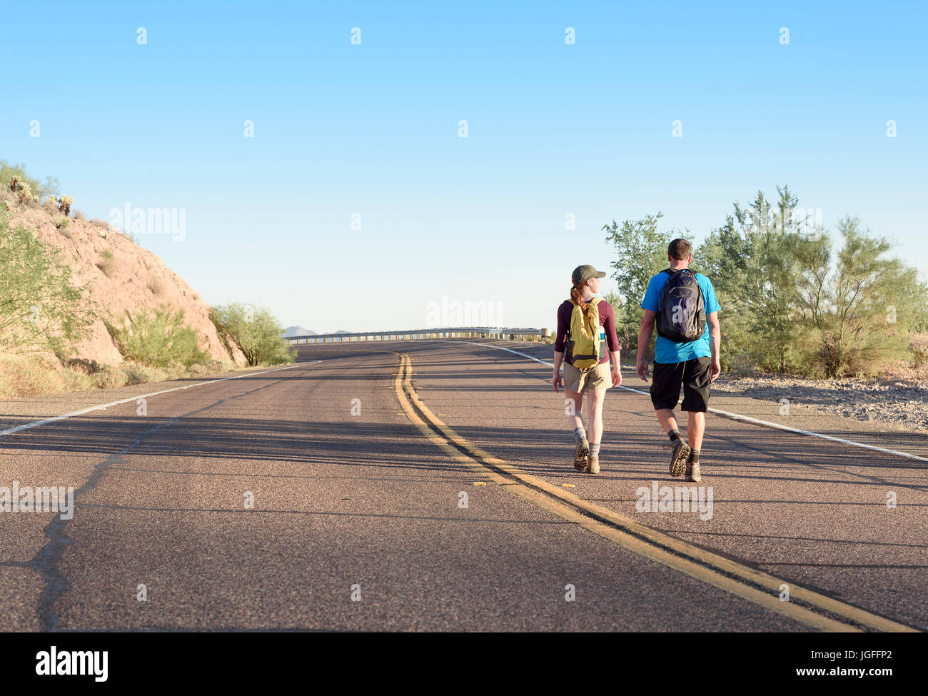 Man walking on winding road hi-res stock photography and images - Alamy