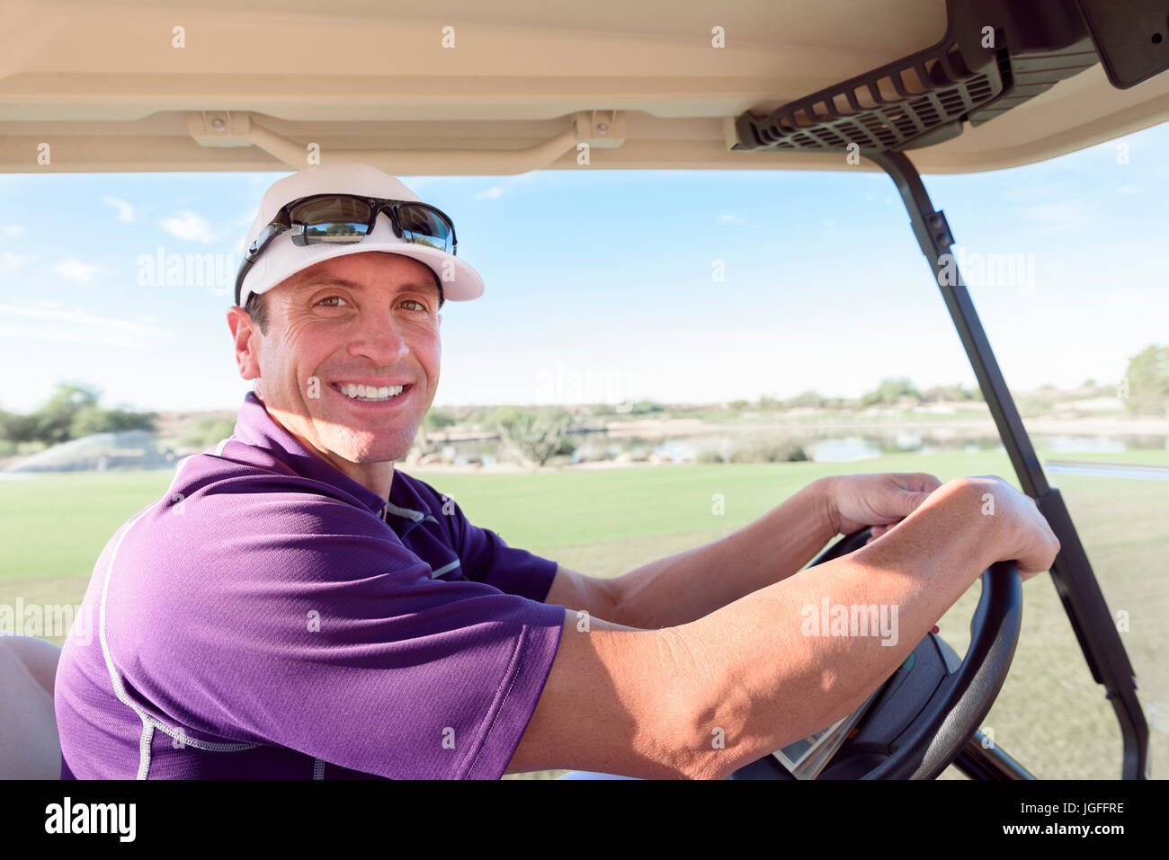 Gold cart driver hi-res stock photography and images - Alamy