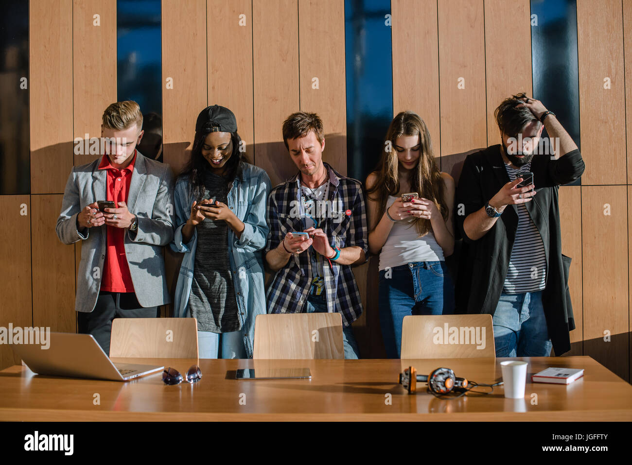 Group of seven people standing hi-res stock photography and images - Alamy