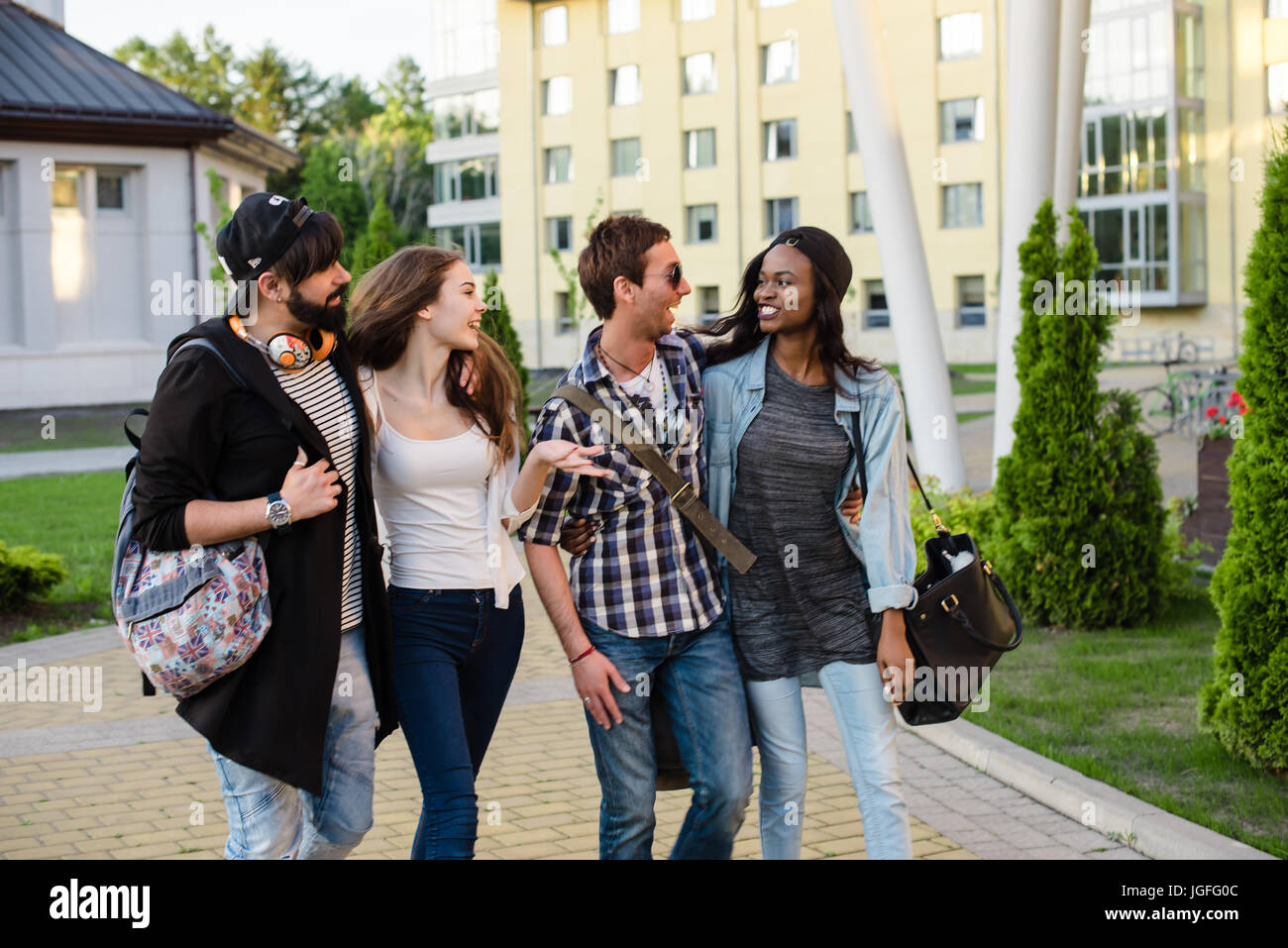 Group of happy students going for lessons. Students wearing casual ...
