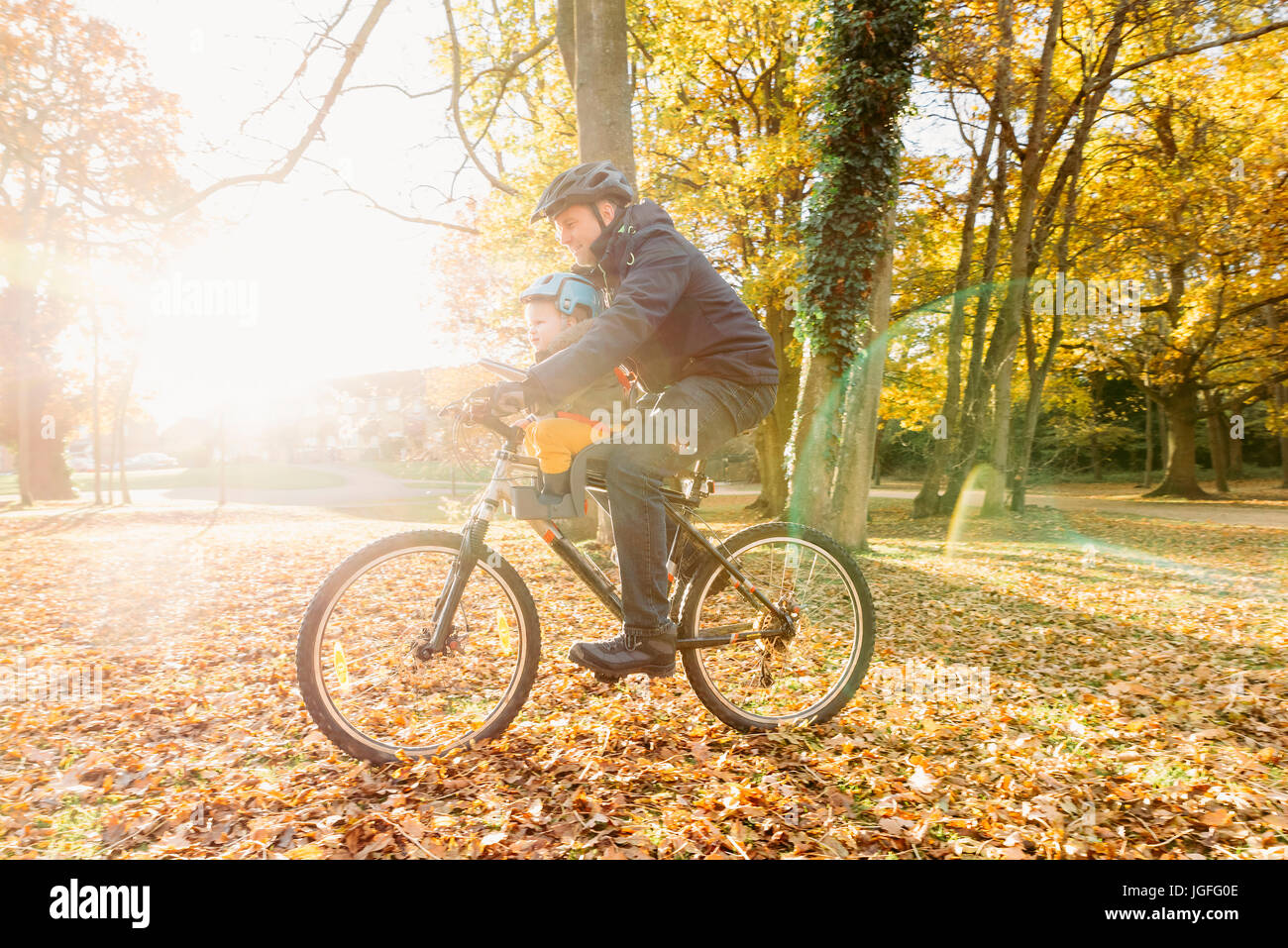 Child riding bicycle side view helmet hi-res stock photography and ...